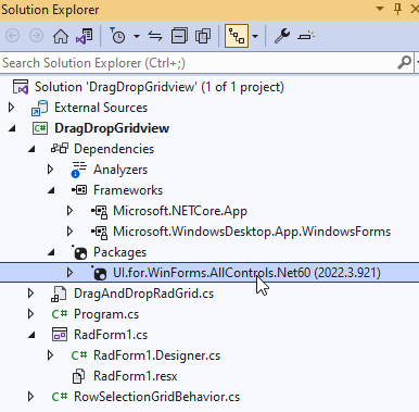 Drag and Drop between two grid views exactly as shown the documentation in UI for WinForms ...